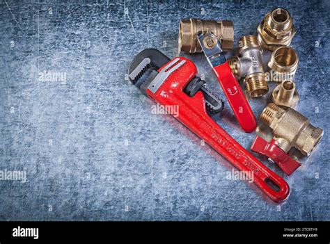 Brass Pipe Connector Monkey Spanner On Metallic Background Plumbing