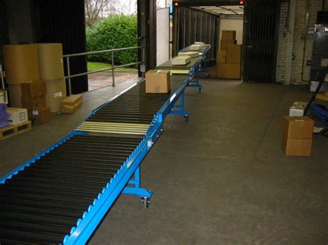 low level straight running container loader unloader for loading docks