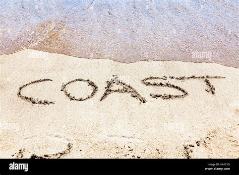 Coast Coastline Coastal Word In Sand Written On Beach Sea Fun Resort Stock Photo Alamy