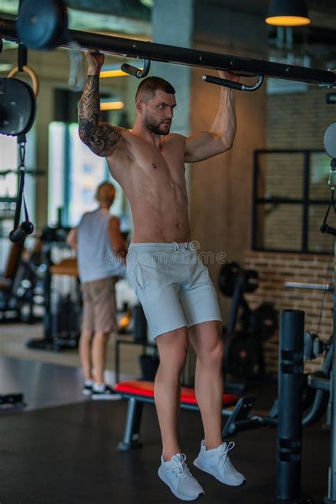 Muscular Man Lifting Weights At Gym Handsome Guy Prepare To Do