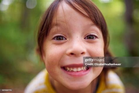 Portrait Of A Smiling Girl Standing Outdoors United States High Res