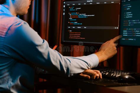 Working It Developer Concentrating Online Software At Neon Light Room Gusher Stock Image