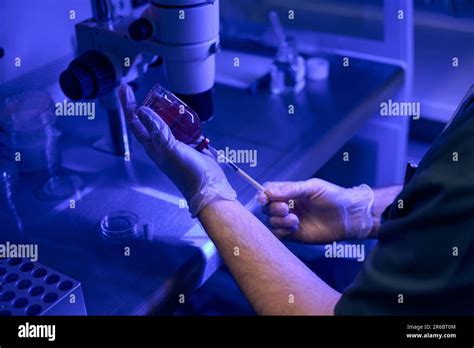 Laboratory Worker Taking Fluid From Flask With Syringe Stock Photo Alamy