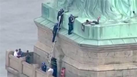 Statue Of Liberty Woman Climbs The Statue Of Liberty Au