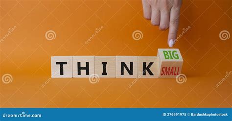 Think Big Vs Small Symbol Businessman Hand Points At Wooden Cubes With Words Think Small And