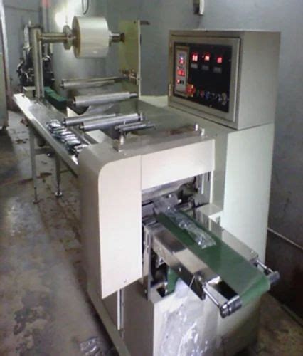 Plastic Three Side Sealing Horizontal Flow Wrap Machine Model Name Number BNE 1005 Packaging