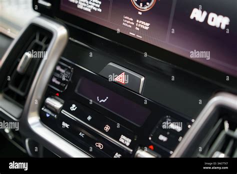 Detailed Look At A Modern Vehicle Dashboard Featuring A Touchscreen Infotainment Display