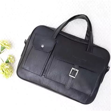 خرید و قیمت کیف دانشجویی و اداری در رنگبندی مشکی و عسلی با ارسال فوری از غرفه کیف و کفش آرمان مشهد