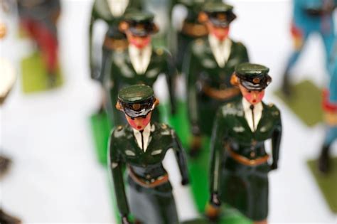 Premium Photo Close Up Of Army Figurines On Table