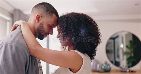 African Couple Dance And Smile In Home With Hug Conversation And Care