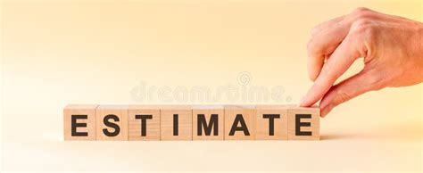 Estimate Symbol Concept Word `estimate` On Wooden Cubes On A Beautiful