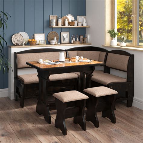 Невеликий деревяний обідній кухонний куточок із дерева на кухню зі столом і мякими табуретками