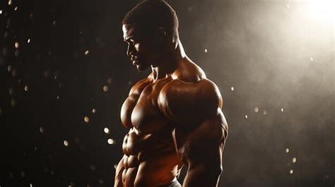 A Man With A Muscular Body And His Arms Spread Out Premium Ai