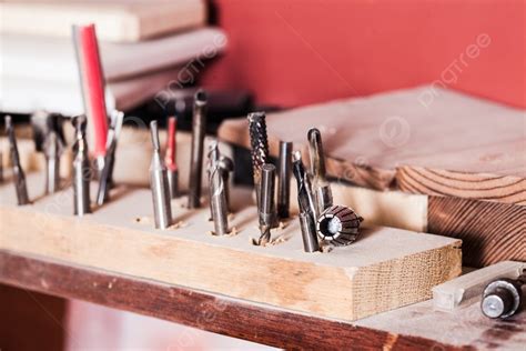 Close View Of Carpenter Tool Set Of Drill Pits Inserted Into A Wooden