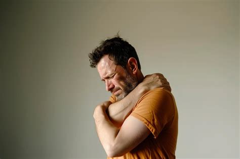 Premium Photo Man Massaging His Sore Shoulders