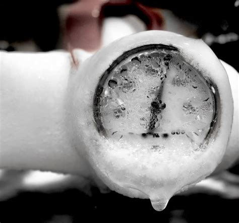 Frozen Liquid Nitrogen Carrying Pipes With A Valve And Black Plastic Lever Close Up In A Science