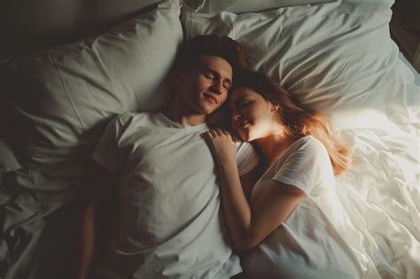 Premium Photo A Man And A Woman Laying In Bed Together