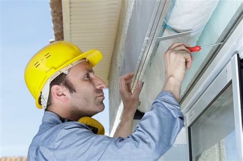 man installing roller shutter on window stock image image of comfort