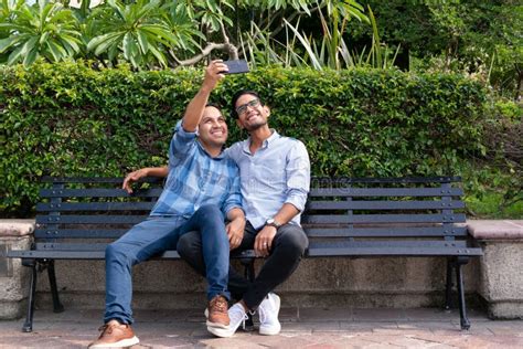 Latin Couple Gay Men Sitting On A Bench Gay Concept Stock Image Image Of Cheerful Friend