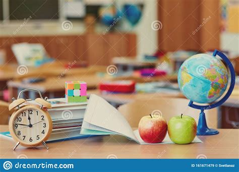 Empty Classroom With Learning Objects Alarm Clock And Globe The