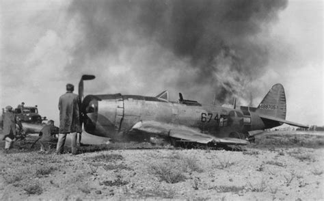 Damage Crews Dousing The Flames After A P 47n Thunderbolt Of The 413th