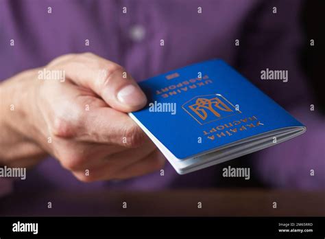 New Ukrainian Blue Biometric Passport With Identification Chip In Hands