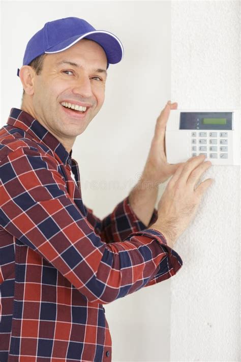 Senior Workman Programming Electronic Keypad Stock Image Image Of Contractor Crime 260339719