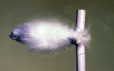 High Speed Photographs Of A 22 Calibre Bullet Blasting Through Objects
