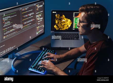 Profile Closeup View Of Young Handsome Program Developer Writing
