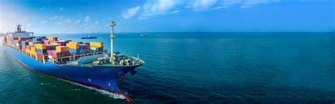 Premium Photo Stern Of Large Cargo Ship Import Export Container Box On The Ocean Sea On Blue