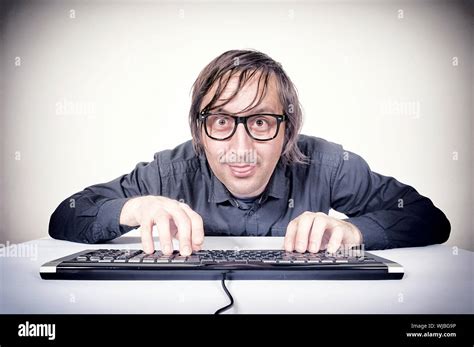 Hacker Typing On The Keyboard And Mocking Stock Photo Alamy