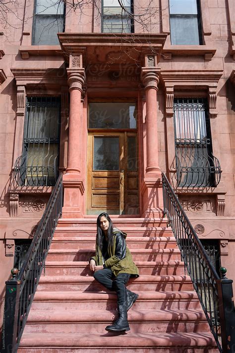 Man Sitting On Stoop Of Brownstone By Stocksy Contributor Lauren Lee
