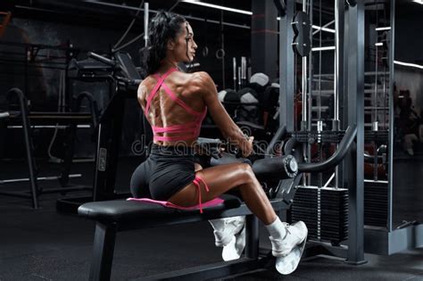 Fitness Woman Working Out In Gym Doing Exercise For Back Athletic Girl