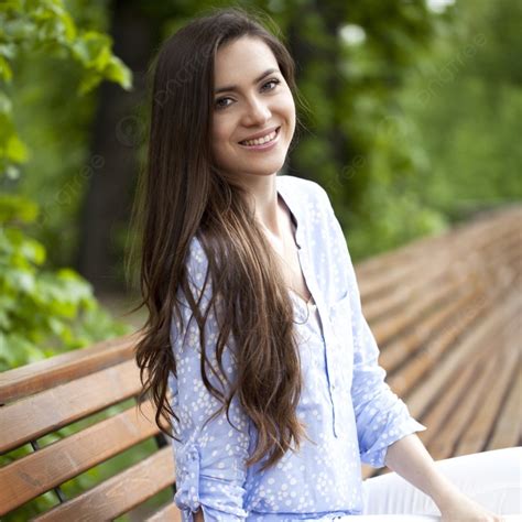 Brunette Sitting On A Bench In A Summer Park Photo Background And Picture For Free Download