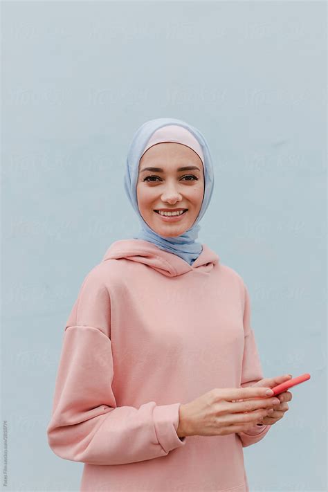 Beautiful Muslim Young Woman In Stylish Outfit And Headscarf Looking
