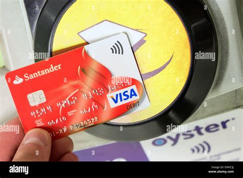 Contactless Santander Visa Card Being Used For Travel Payment At London Underground Station