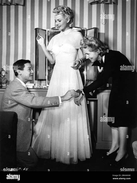 Eva Gabor And Fred Clark Look To Glenn Ford In A Scene From The Film
