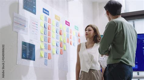 Brainstorming Session Using Sticky Notes On A Task Board Kanban To Organize Ideas And