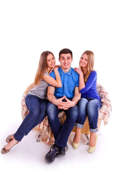 Guy With Two Girls Sitting On The Couch Stock Image Image Of Happy