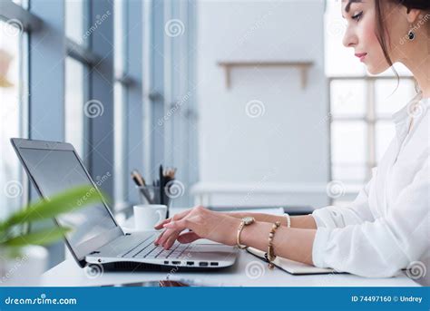 Attractive Female Assistant Working Typing Using Portable Computer