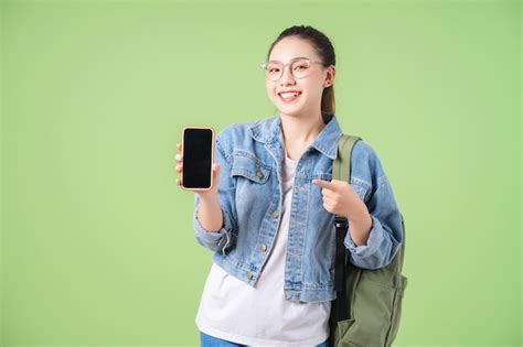 Premium Photo Photo Of Young Asian College Girl On Green Background Premium Photo Photo Of Young Asian College Girl On Green Background