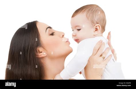 Mother Kissing Her Baby Stock Photo Alamy