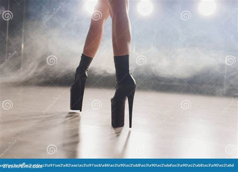Young Striptease Dancer Moving In High Heels Shoes On Stage In Strip