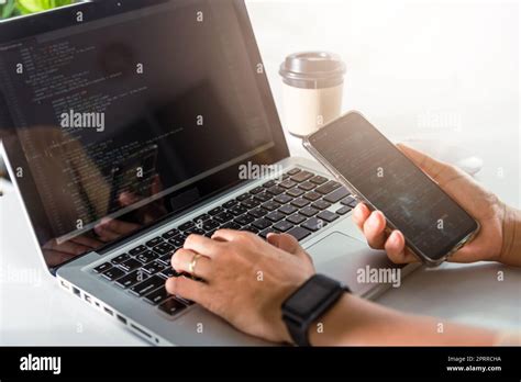 Programmer Woman Looking Mobile Phone Program Code At Workplace Software Developer Hands Typing