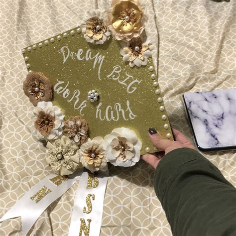 My Graduation Cap Decorated With White Faux Flowers Pearls And Gold