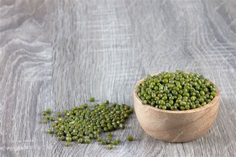 Premium Photo Green Beans Overflow Wooden Bowls And Pile On Gray Wood