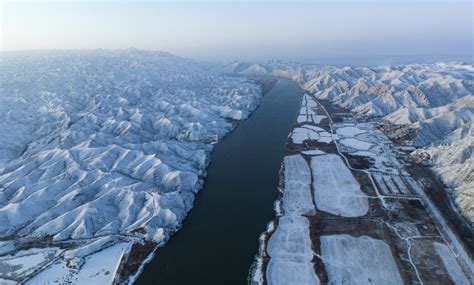 大雪过后宁夏青铜峡黄河大峡谷银装素裹黄河从峡谷间流过美如画卷 New China 中文 xinhuachinese