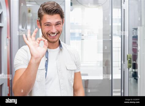 Man Standing Before Glass Partition And Sliding Door In Modern Office
