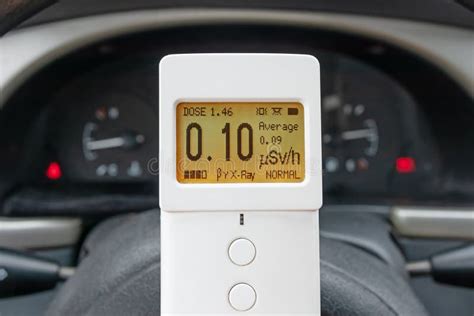 Measuring Ionizing Radiation In A Car Using A Modern Digital Radiometer Dosimeter Device Stock