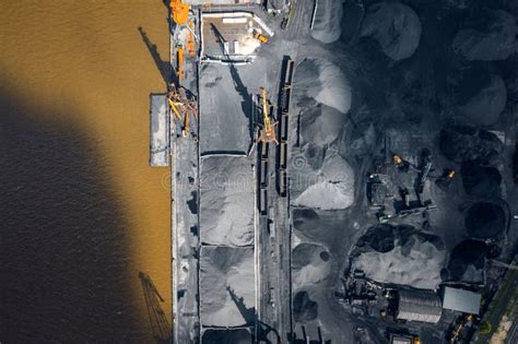 loading and unloading coal on ship terminal sea cargo port industrial